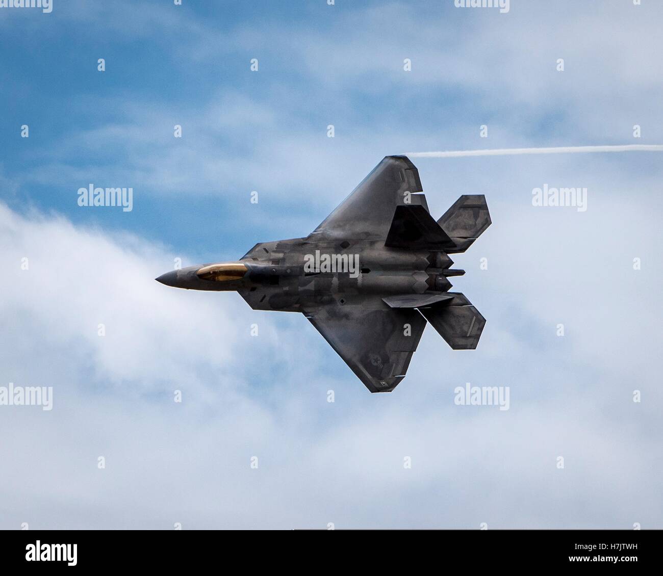 An F-22 Raptor stealth fighter aircraft performs an aerial maneuver ...