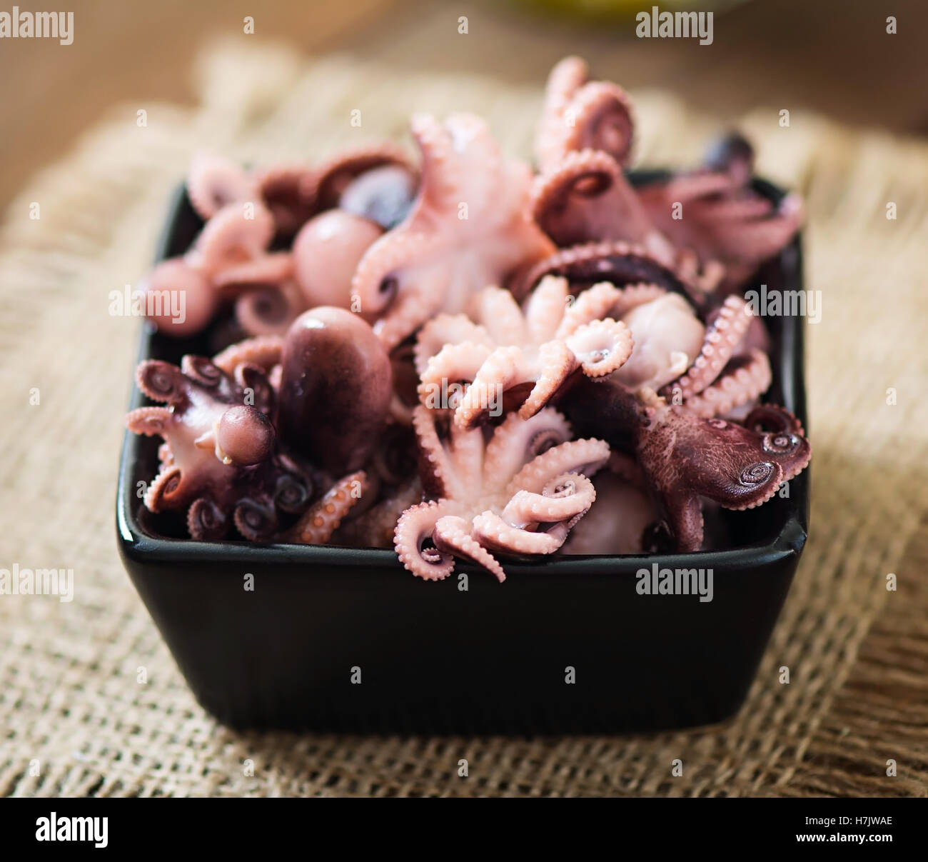 Appetizer small marinated octopus squid hi-res stock photography and ...