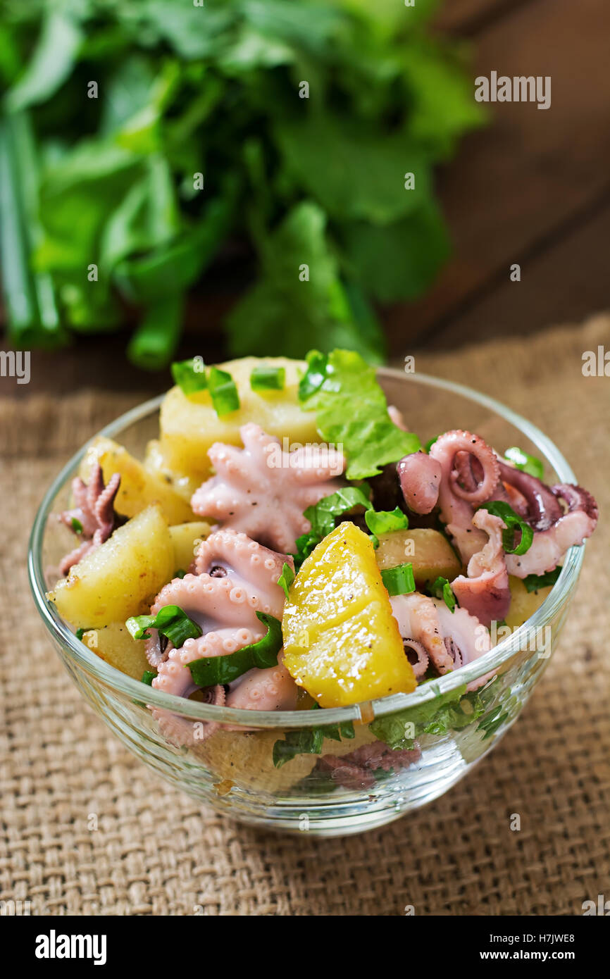 Potato salad with pickled octopus and green onions Stock Photo - Alamy