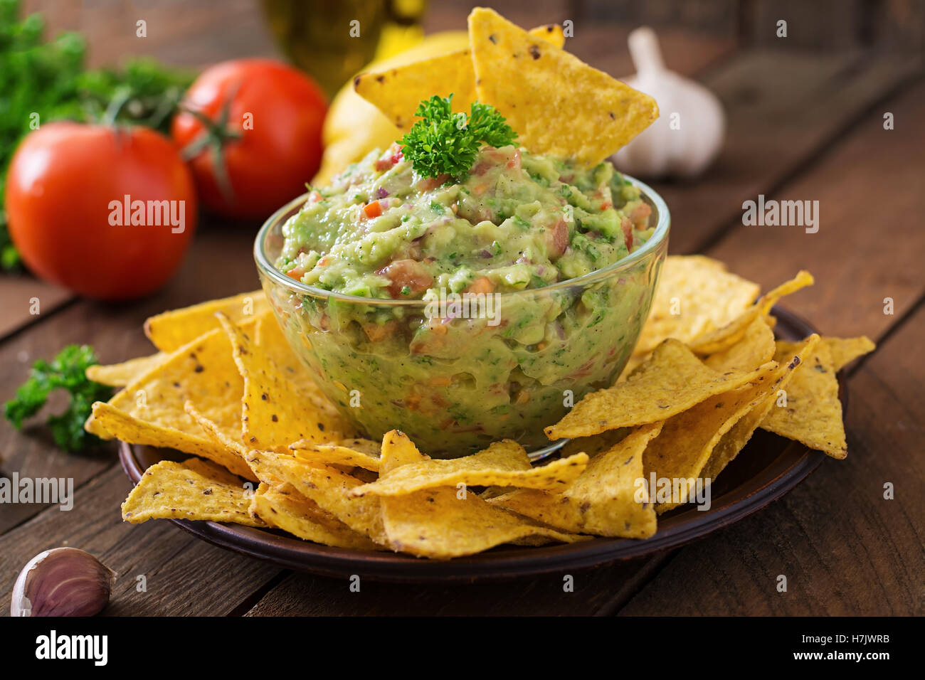 Guacamole avocado, lime, tomato, onion and cilantro, served with nachos ...