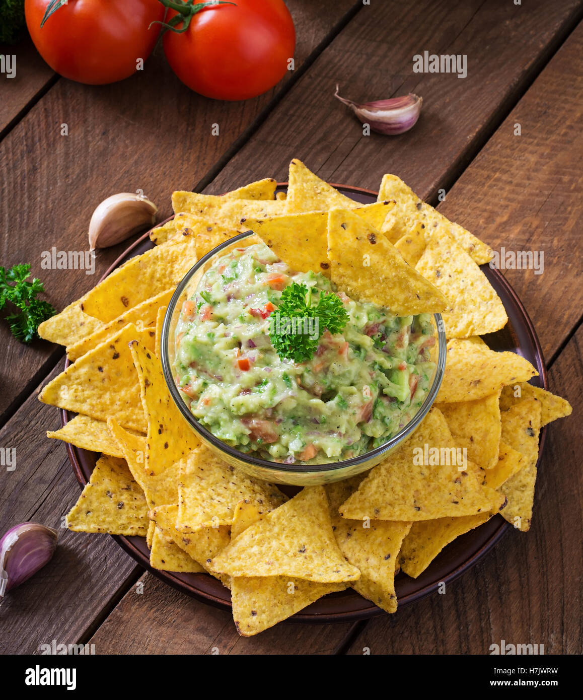 Guacamole avocado, lime, tomato, onion and cilantro, served with nachos ...
