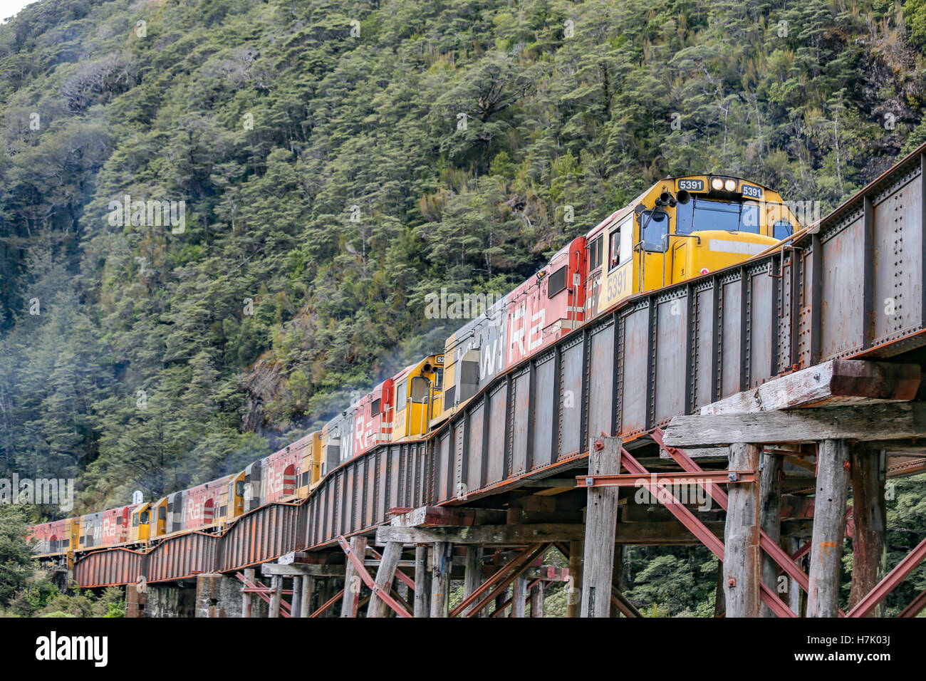 Arthurs Pass, New Zealand: A Kiwirail freight train crosses the Bealey ...