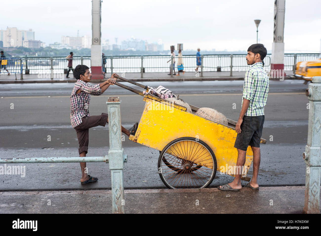 Streeet Cleaner Pushing Trolley on Howrah Bridge (Rabindra Setu) in ...