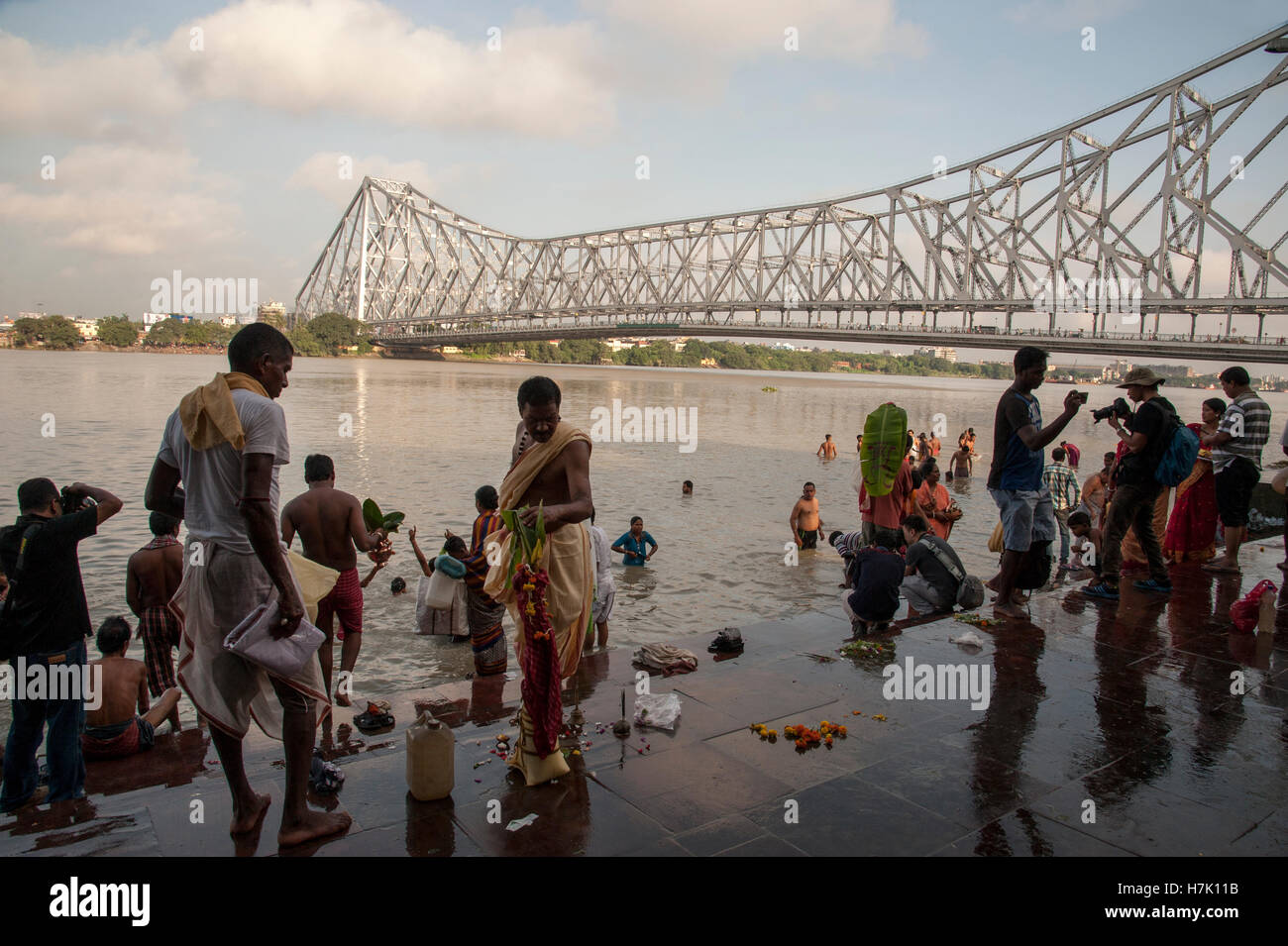 Priest going for kola bou snan puja at mallick ghat kolkata west bengal ...