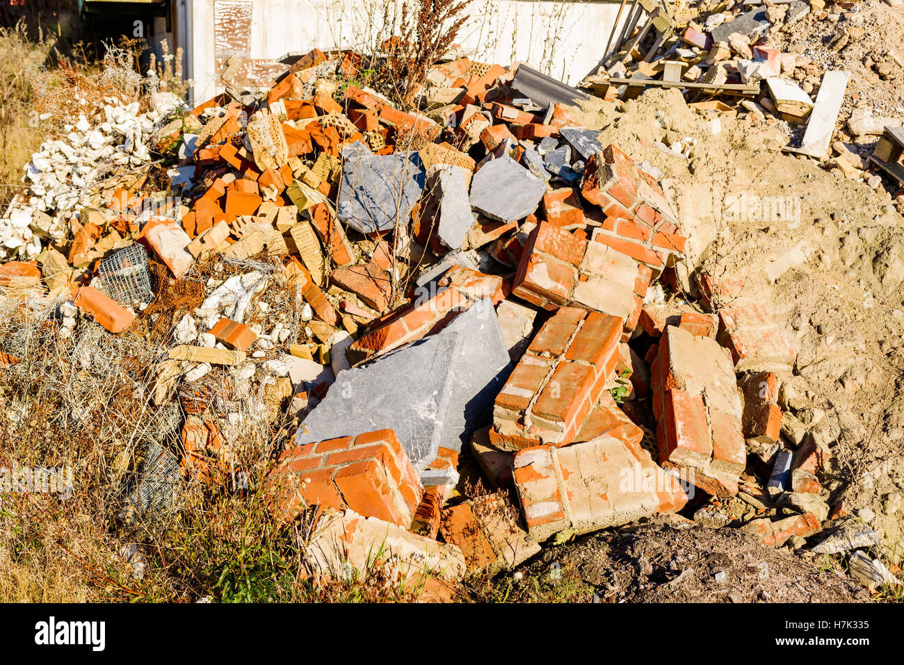 Pile of bricks and concrete debris after a demolition of a building Stock Photo - Alamy