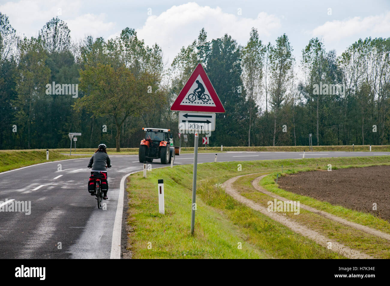 Cycling warning sign. Austria. Model release available Stock Photo - Alamy