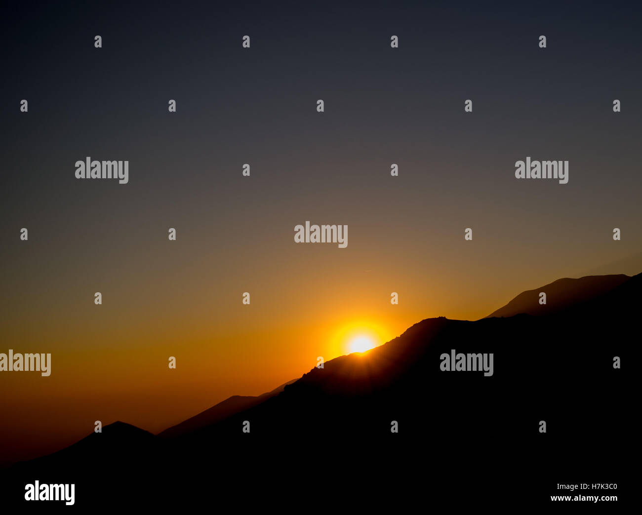 sunset in mountains Stock Photo - Alamy
