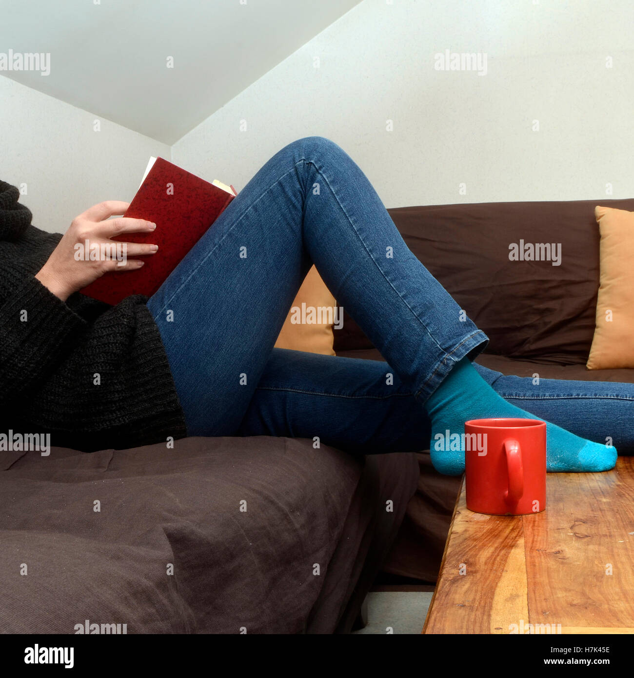 Woman socks couch hi-res stock photography and images - Alamy