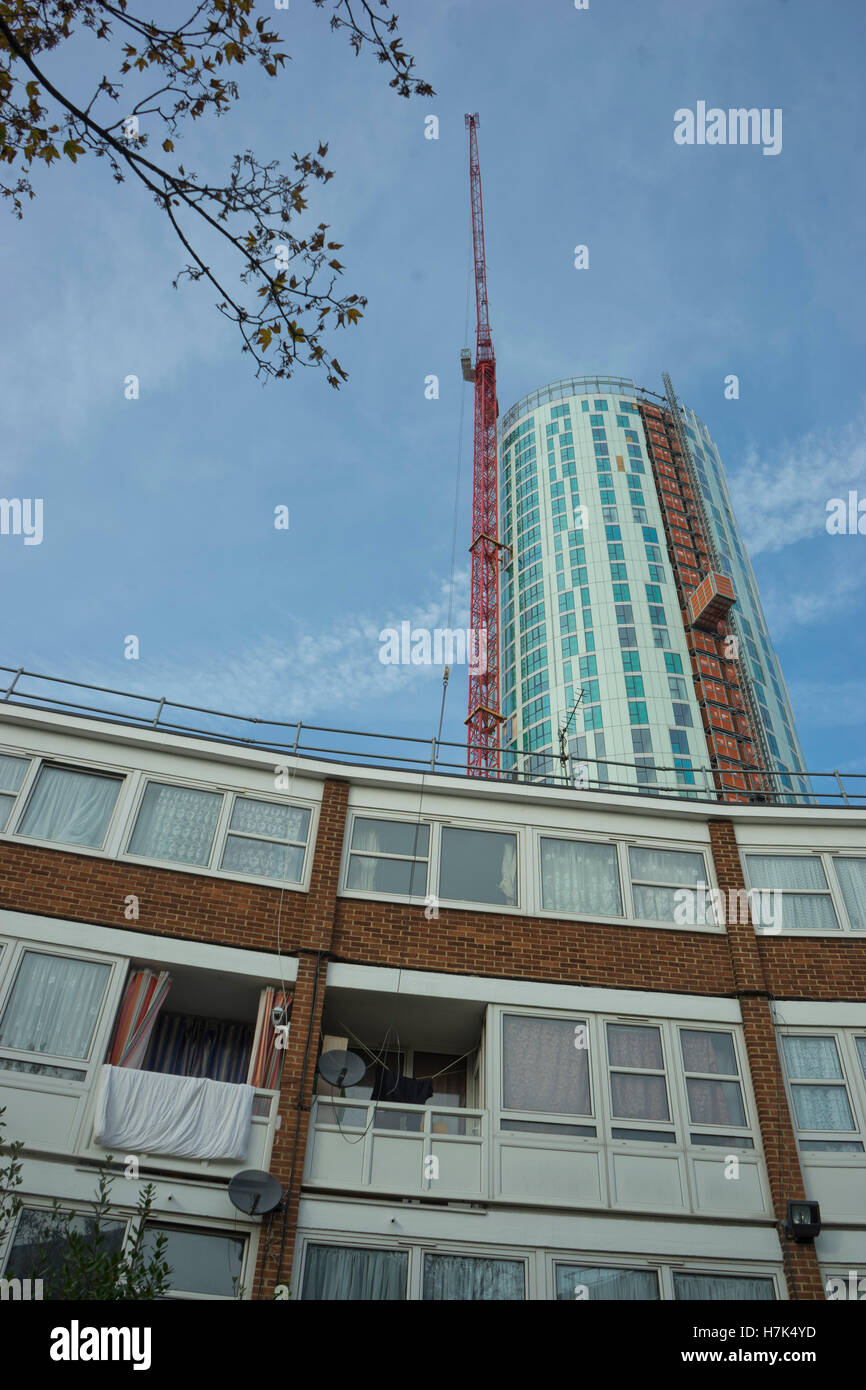 New building development construction by old council houses near the ...