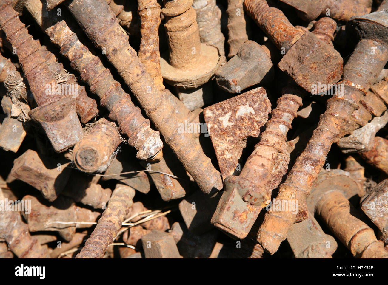 Old rusted bolts sleepers screws as a background Stock Photo - Alamy
