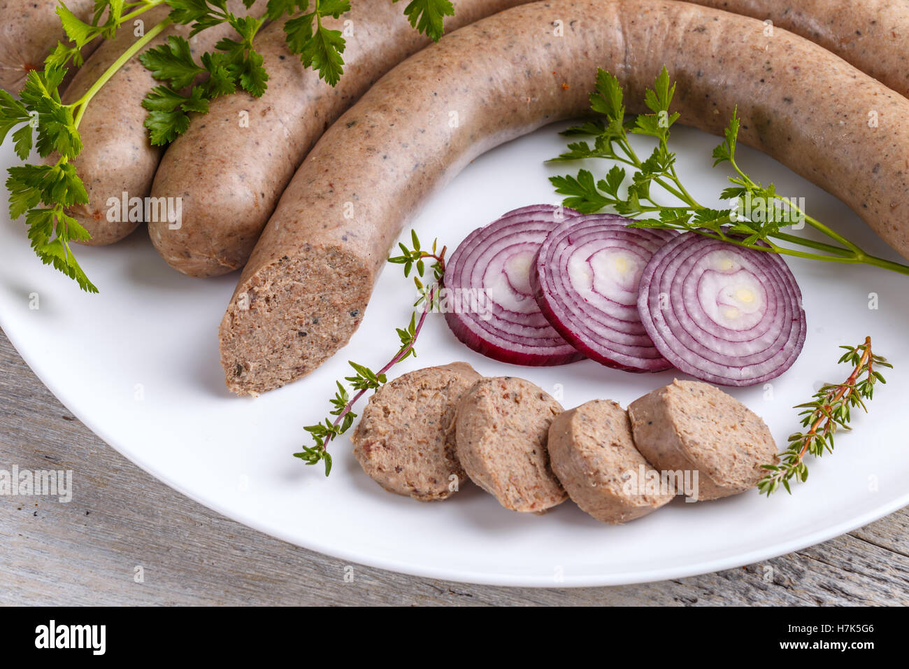 White pudding sausage served with onion Stock Photo - Alamy