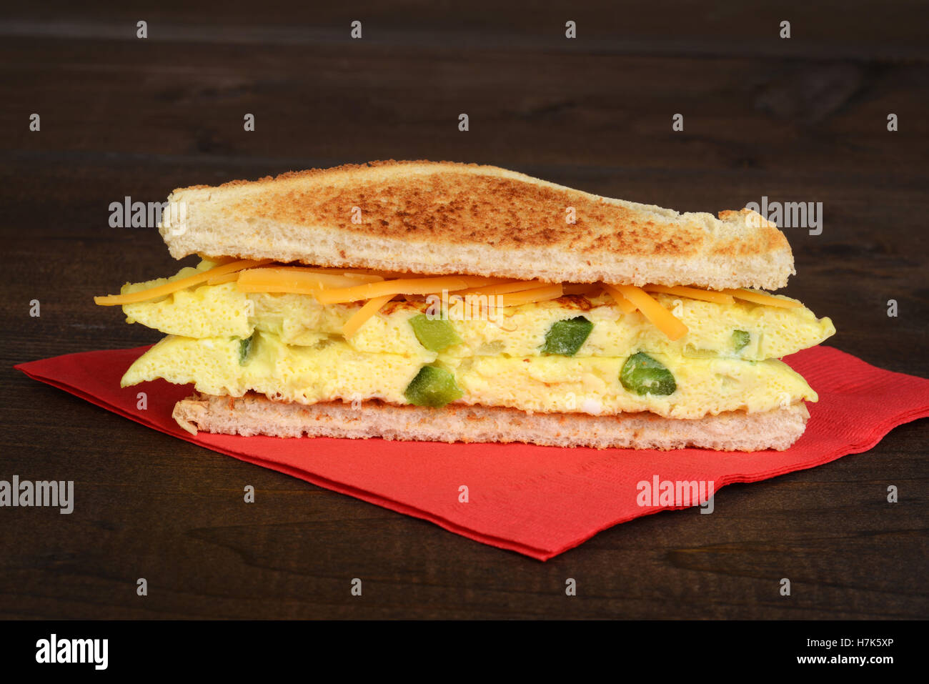 toasted western sandwich on red napkin Stock Photo - Alamy