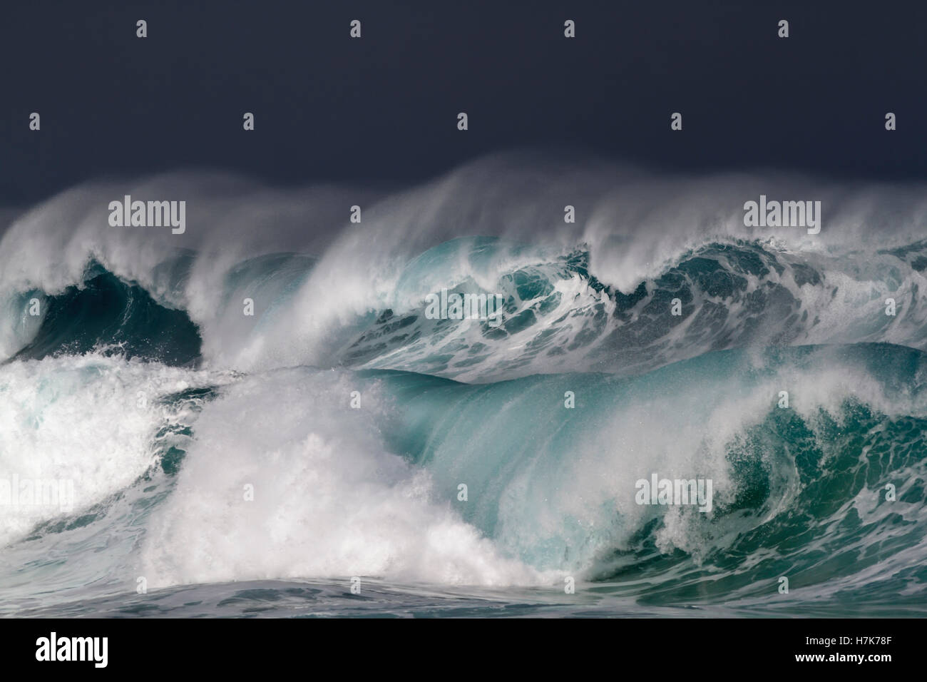Beautiful breaking wave with dark background Stock Photo - Alamy