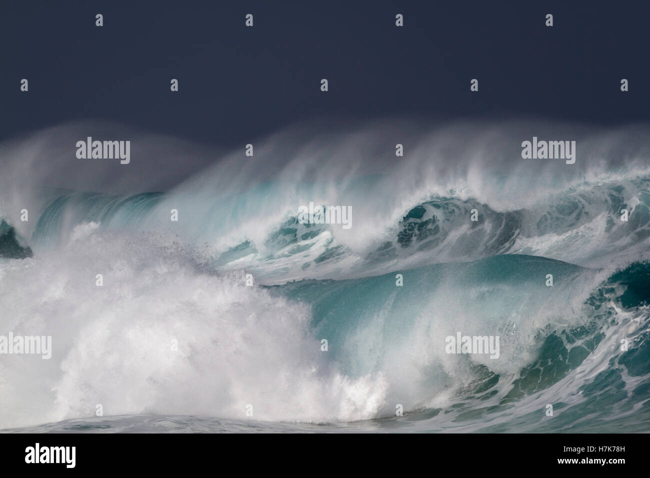 Beautiful breaking wave with dark background Stock Photo - Alamy