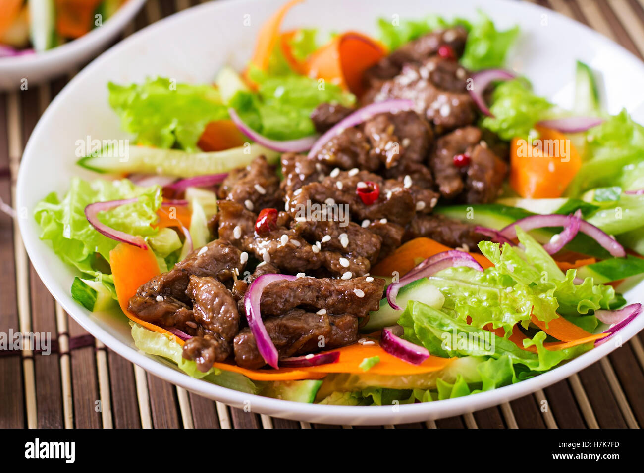 Salad with beef teriyaki Stock Photo - Alamy