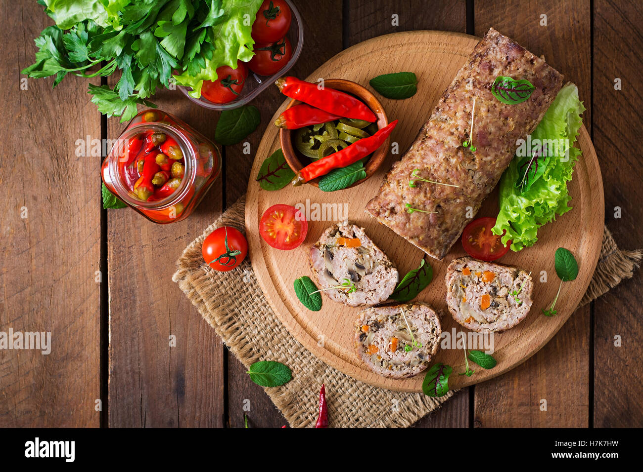 Minced meat loaf roll with mushrooms and carrots. Top view Stock Photo ...