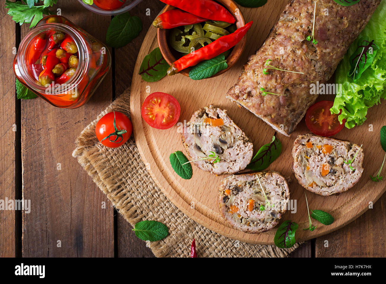 Minced meat loaf roll with mushrooms and carrots. Top view Stock Photo ...