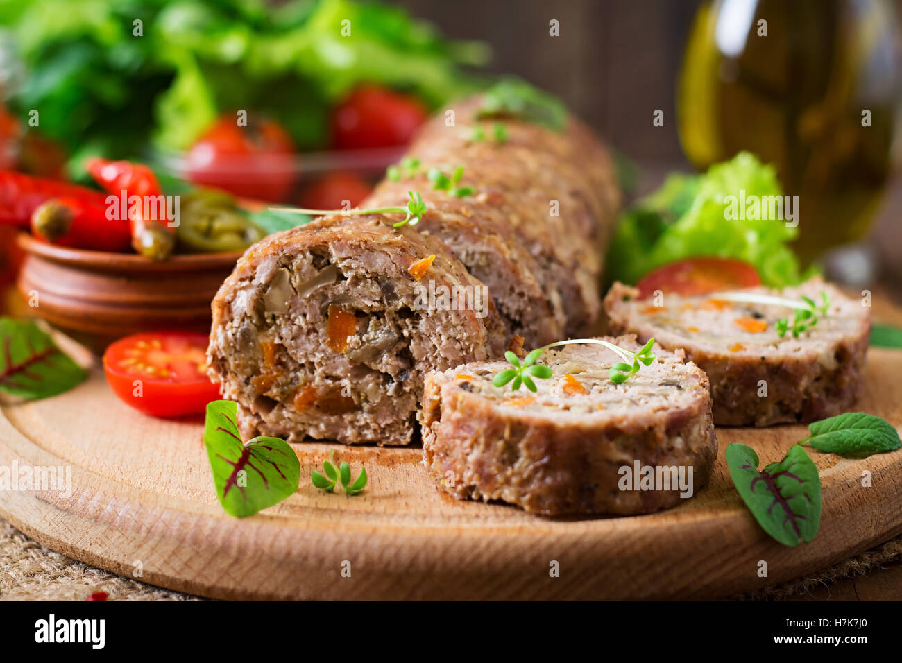 Minced meat loaf roll with mushrooms and carrots Stock Photo - Alamy
