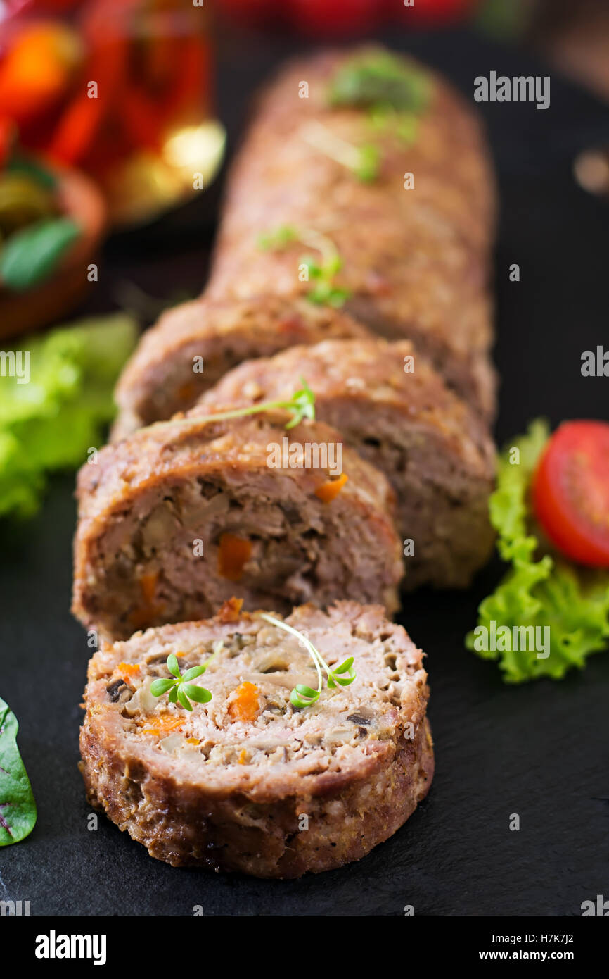 Minced meat loaf roll with mushrooms and carrots Stock Photo - Alamy