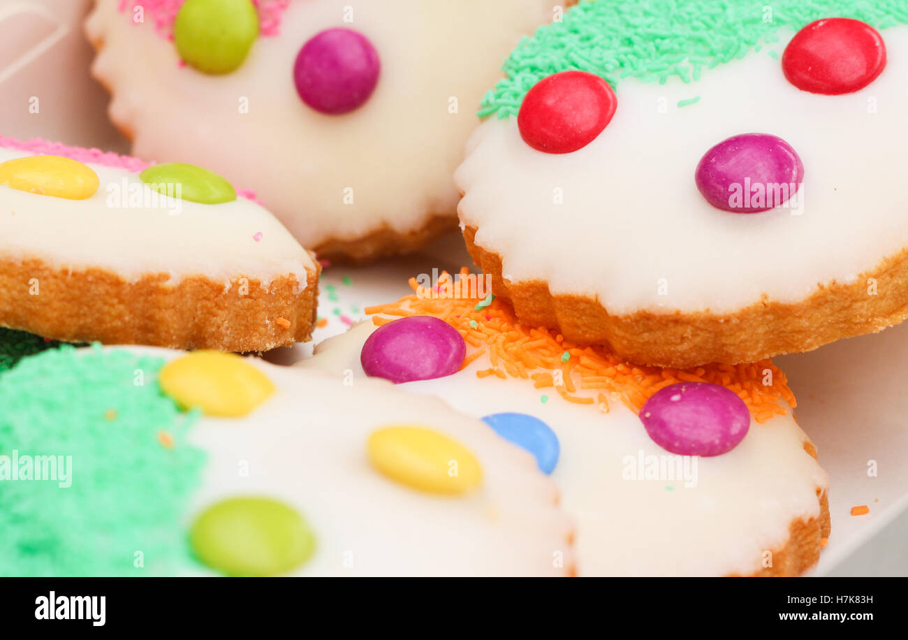 Box of colourful sprinkle happy face biscuits Stock Photo - Alamy