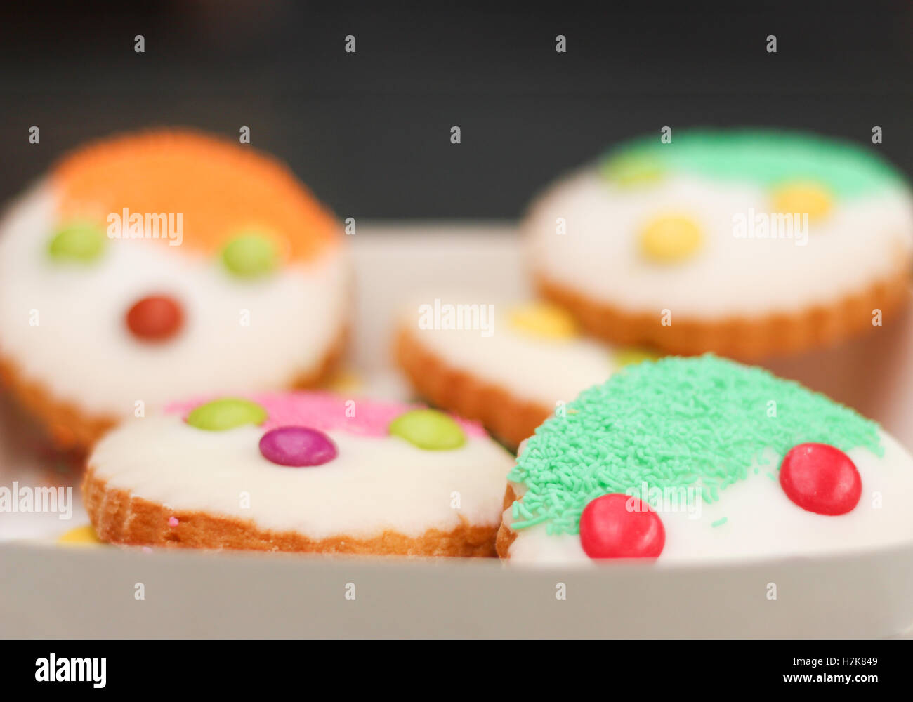 Box of colourful sprinkle happy face biscuits Stock Photo - Alamy