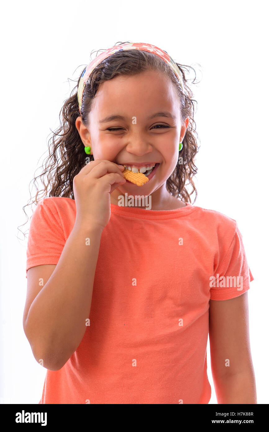 Happy Young Girl Eating Biscuit Isolated on White Background Stock ...