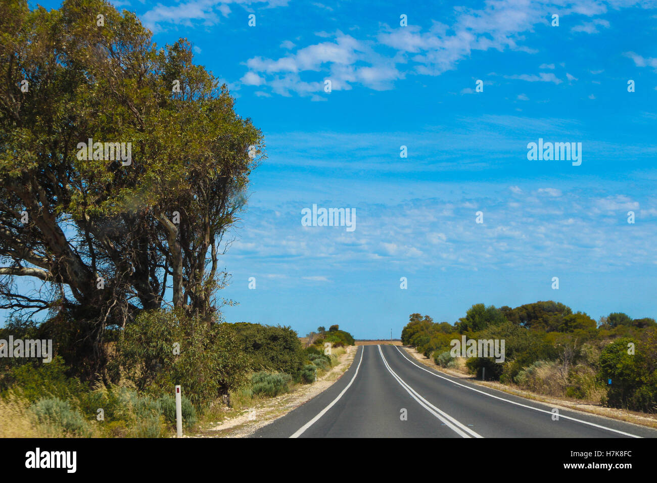 Long stretch of road in the Australian Outback during a Summer road ...