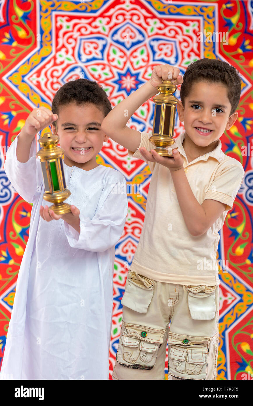 Two Muslim Young Boys Celebrating Ramadan with Ramadan Festive Curtain ...