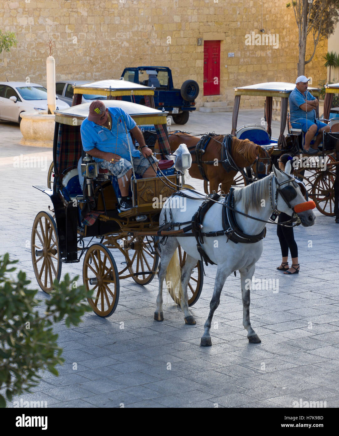 Mdina, old walled city baroque architecture. Horse drawn caleche taxi ...