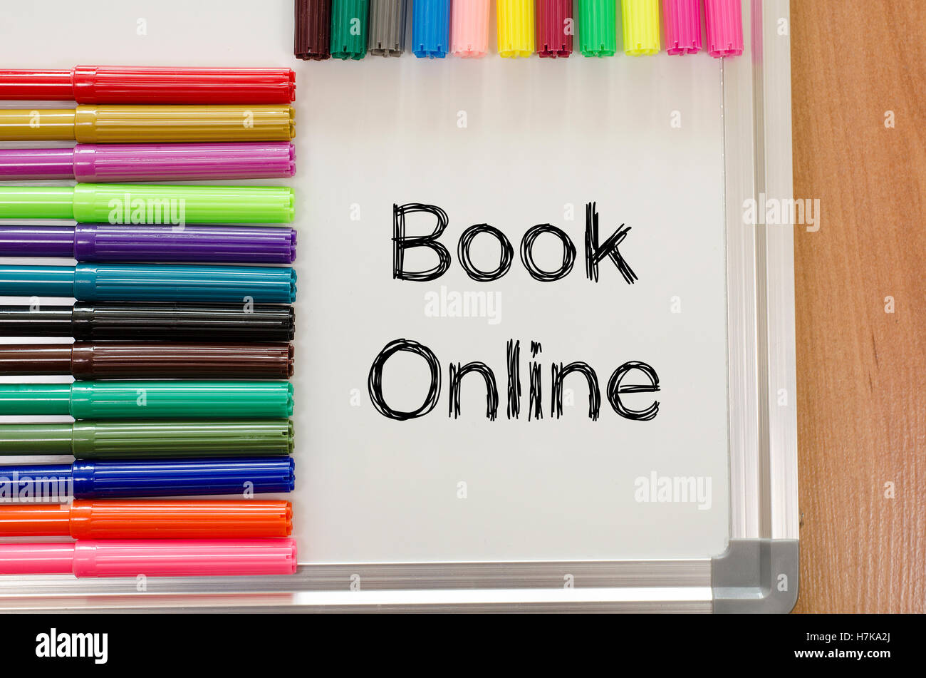 Book online text concept over whiteboard background Stock Photo - Alamy