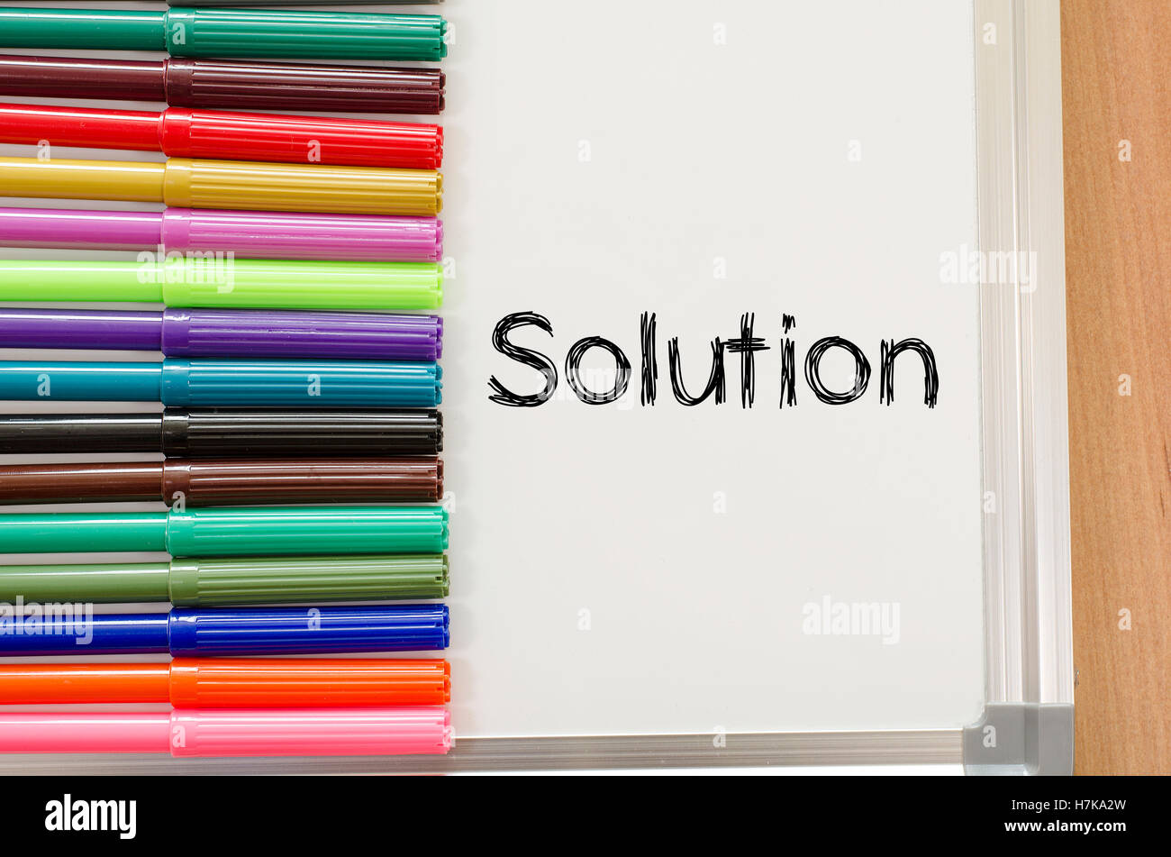 Solution text concept over whiteboard background Stock Photo - Alamy