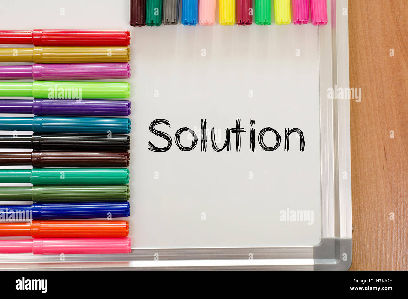 Solution text concept over whiteboard background Stock Photo - Alamy