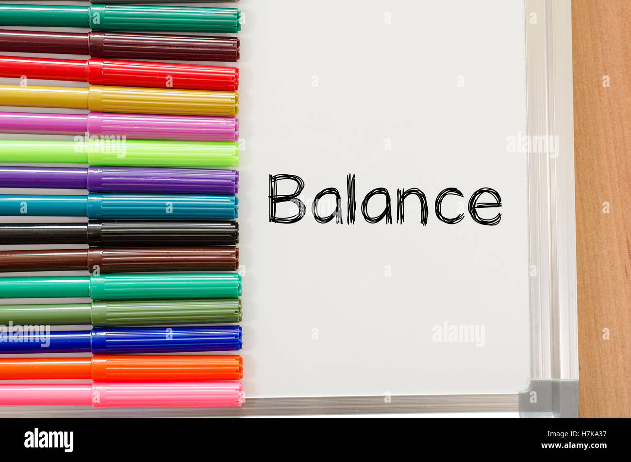 Balance text concept over whiteboard background Stock Photo - Alamy