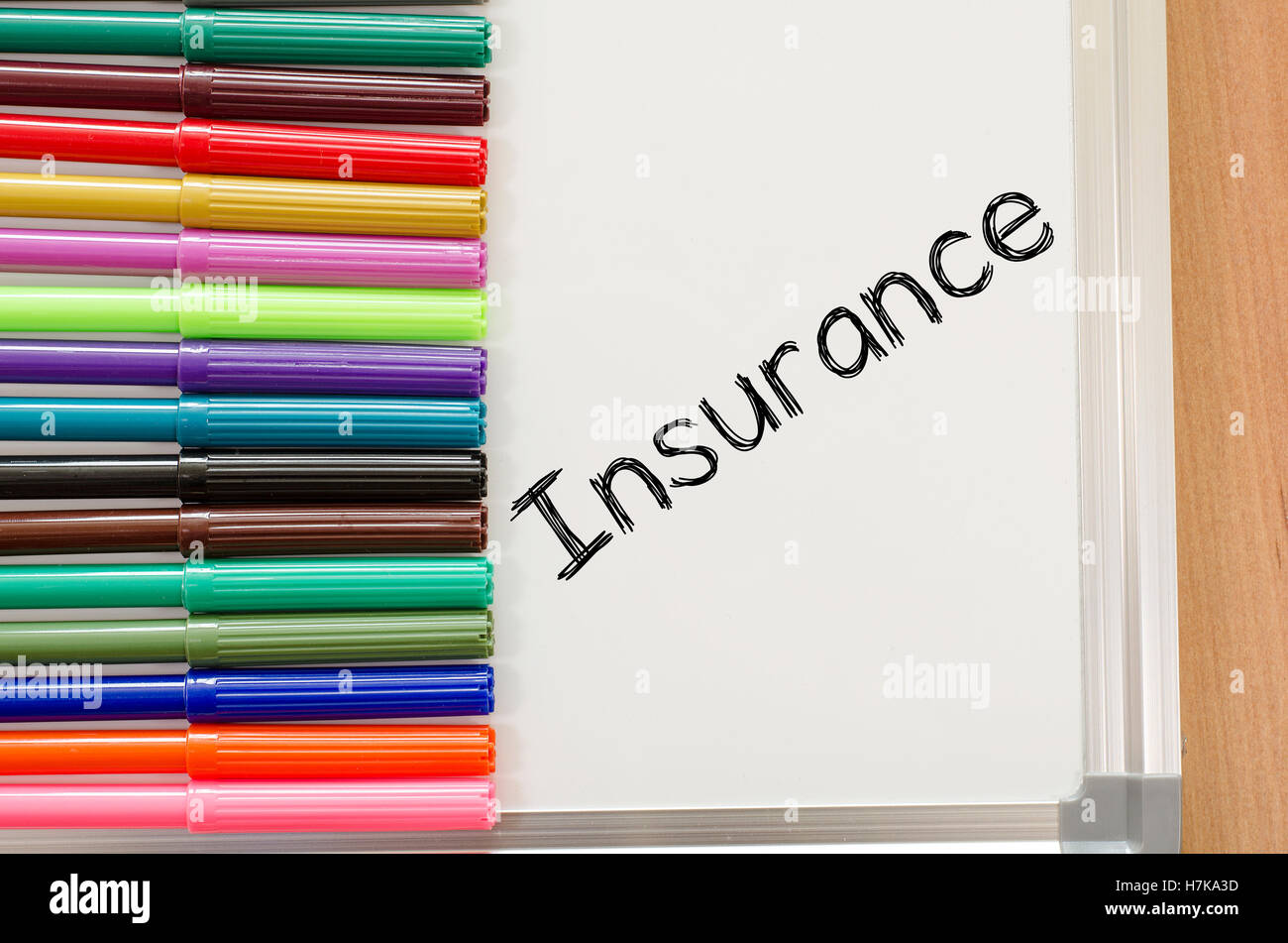 Insurance text concept over whiteboard background Stock Photo - Alamy