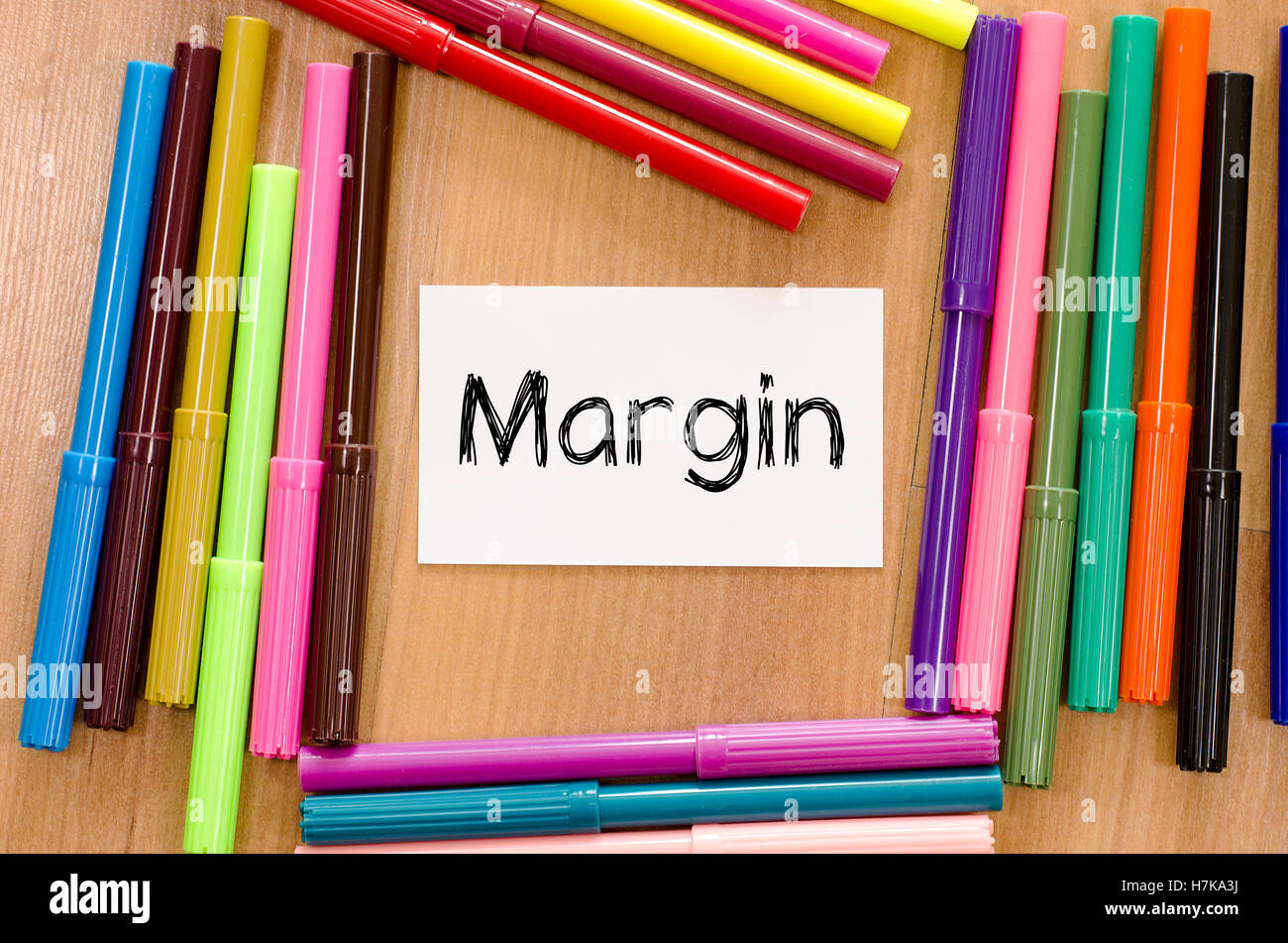 Margin text concept over note background Stock Photo - Alamy