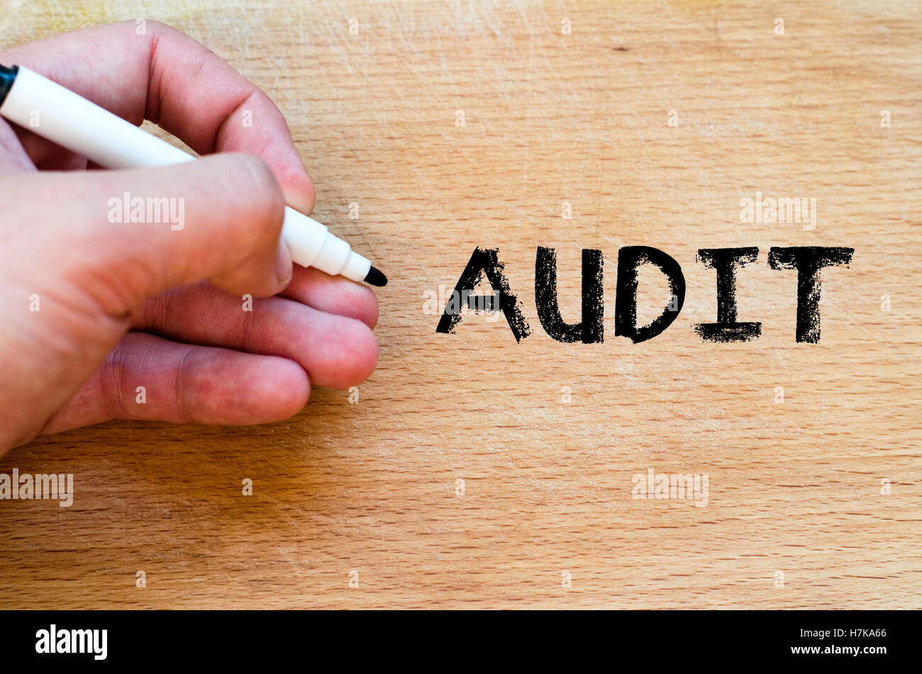 Human hand over wooden background and audit text concept Stock Photo ...