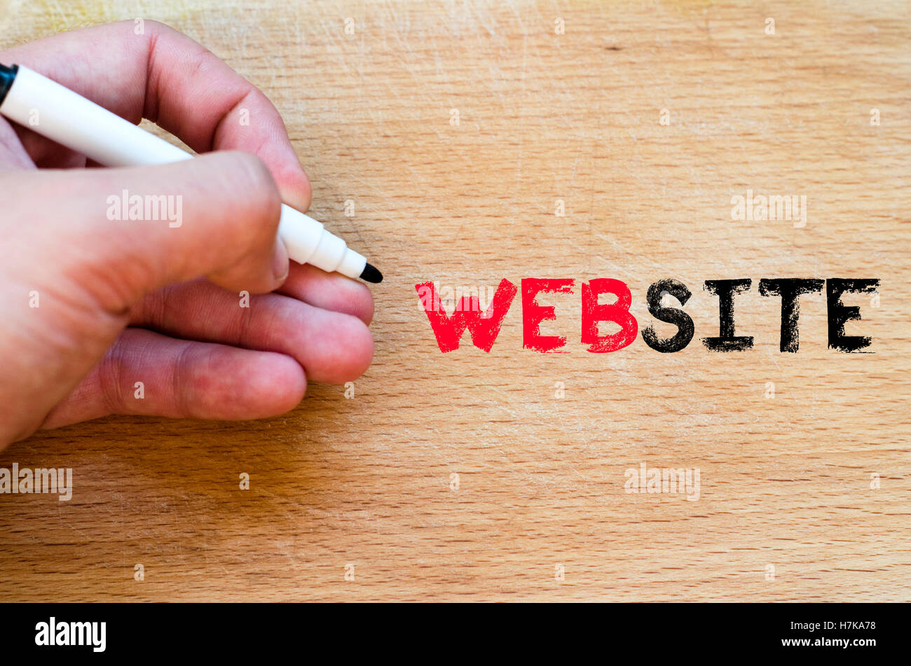 Human hand over wooden background and website text concept Stock Photo ...