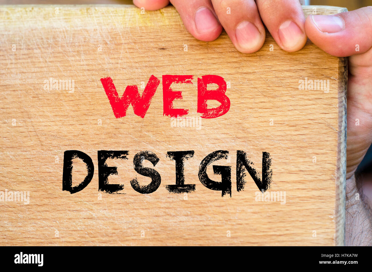 Human hand over wooden background and web design text concept Stock ...