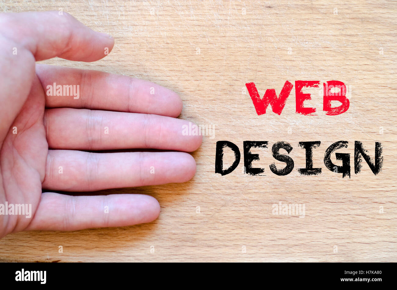 Human hand over wooden background and web design text concept Stock ...