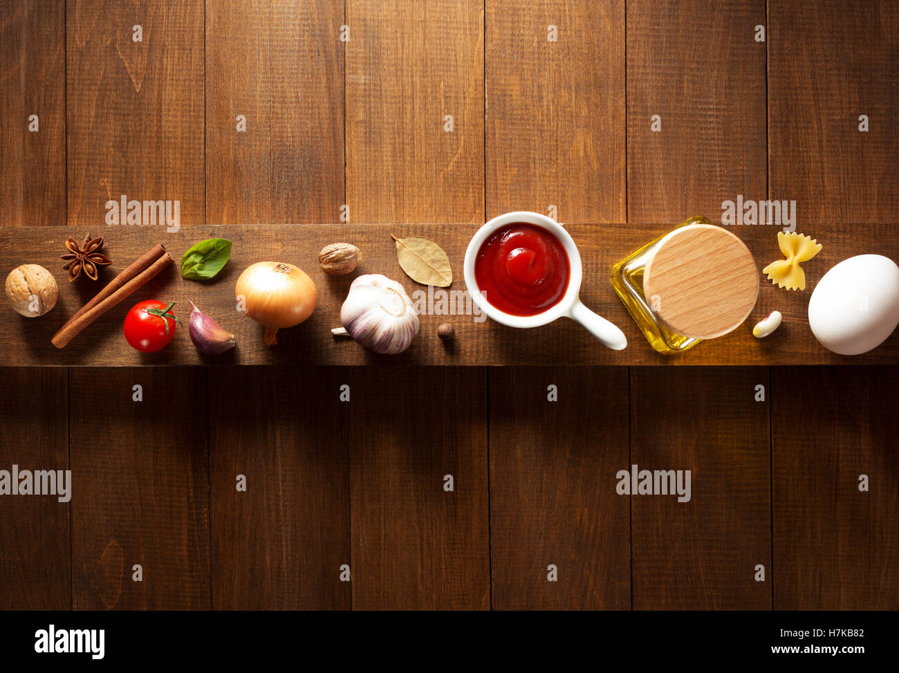 spice and herbs ingredients at wooden table Stock Photo - Alamy