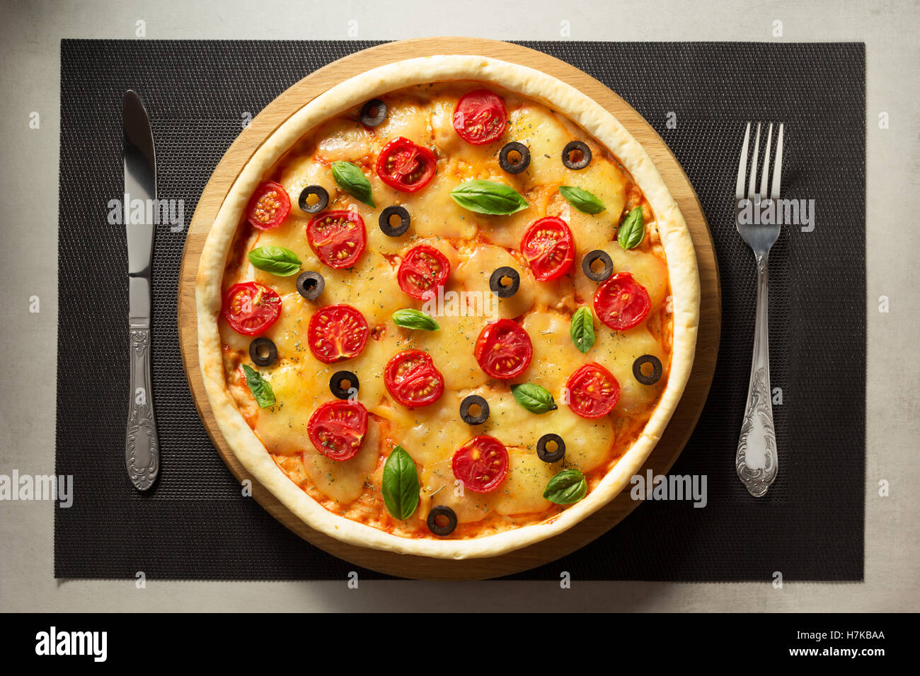 italian pizza at table surface background Stock Photo - Alamy