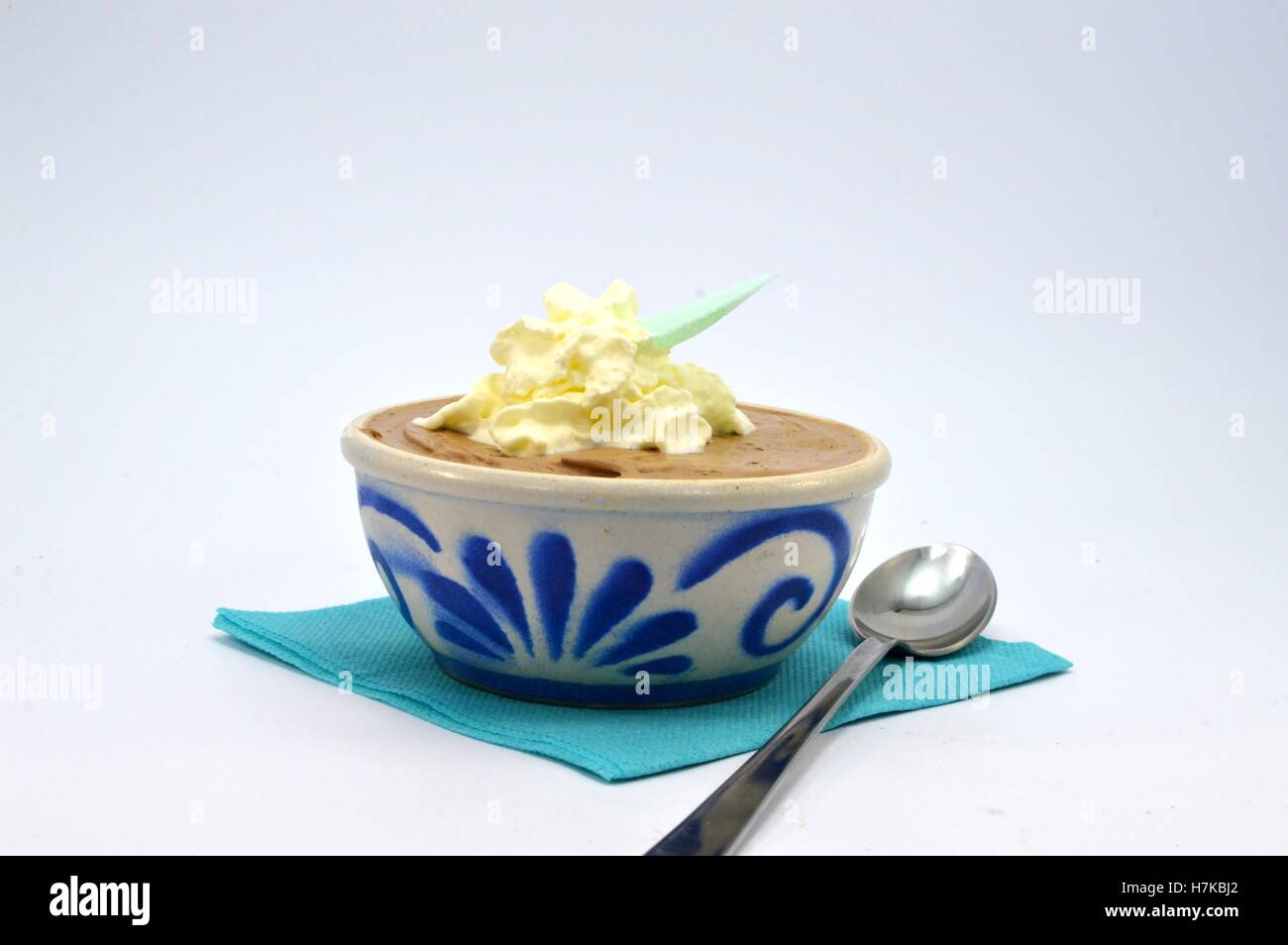 A dark chocolate mousse in a ramekin porcelain on a blue towel Stock ...