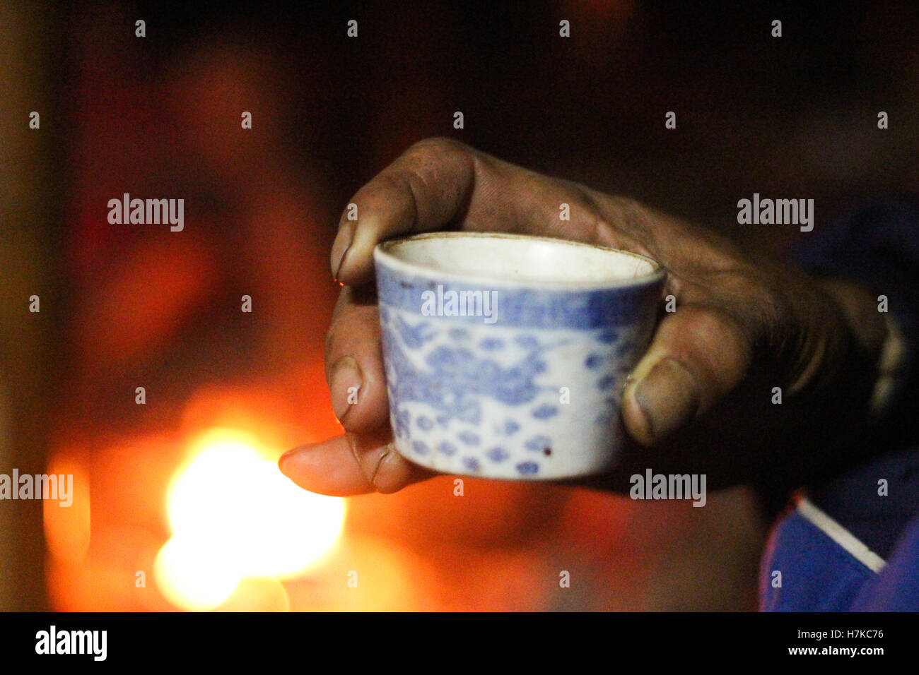 Thai farmer offering home made rice wine Stock Photo - Alamy