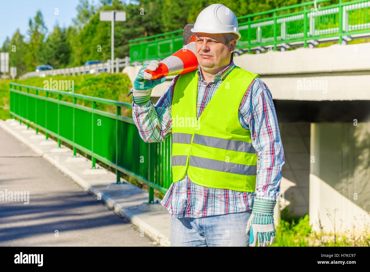 Road construction worker with traffic cone Stock Photo - Alamy
