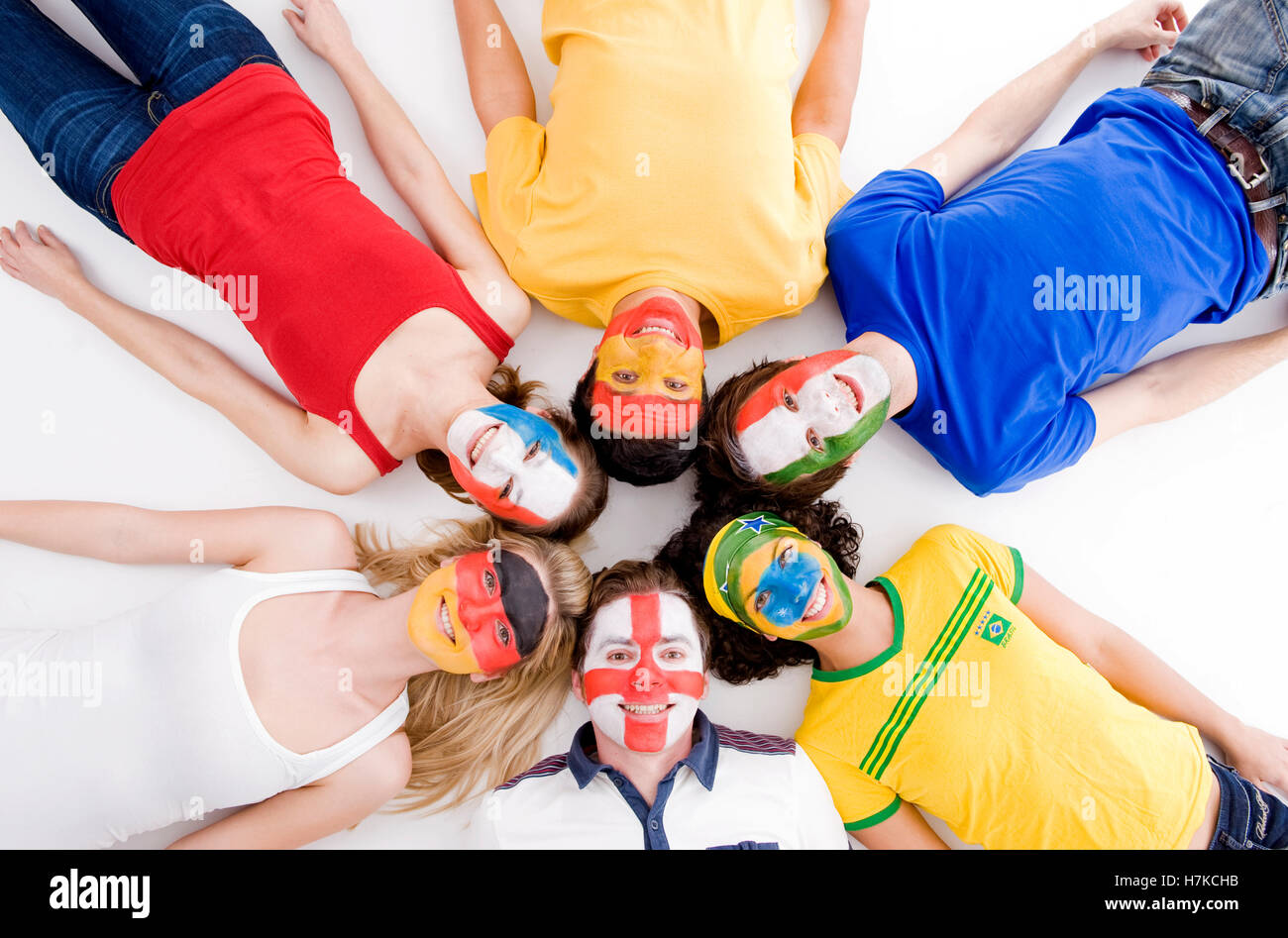 Young people with faces painted in different national colours Stock ...