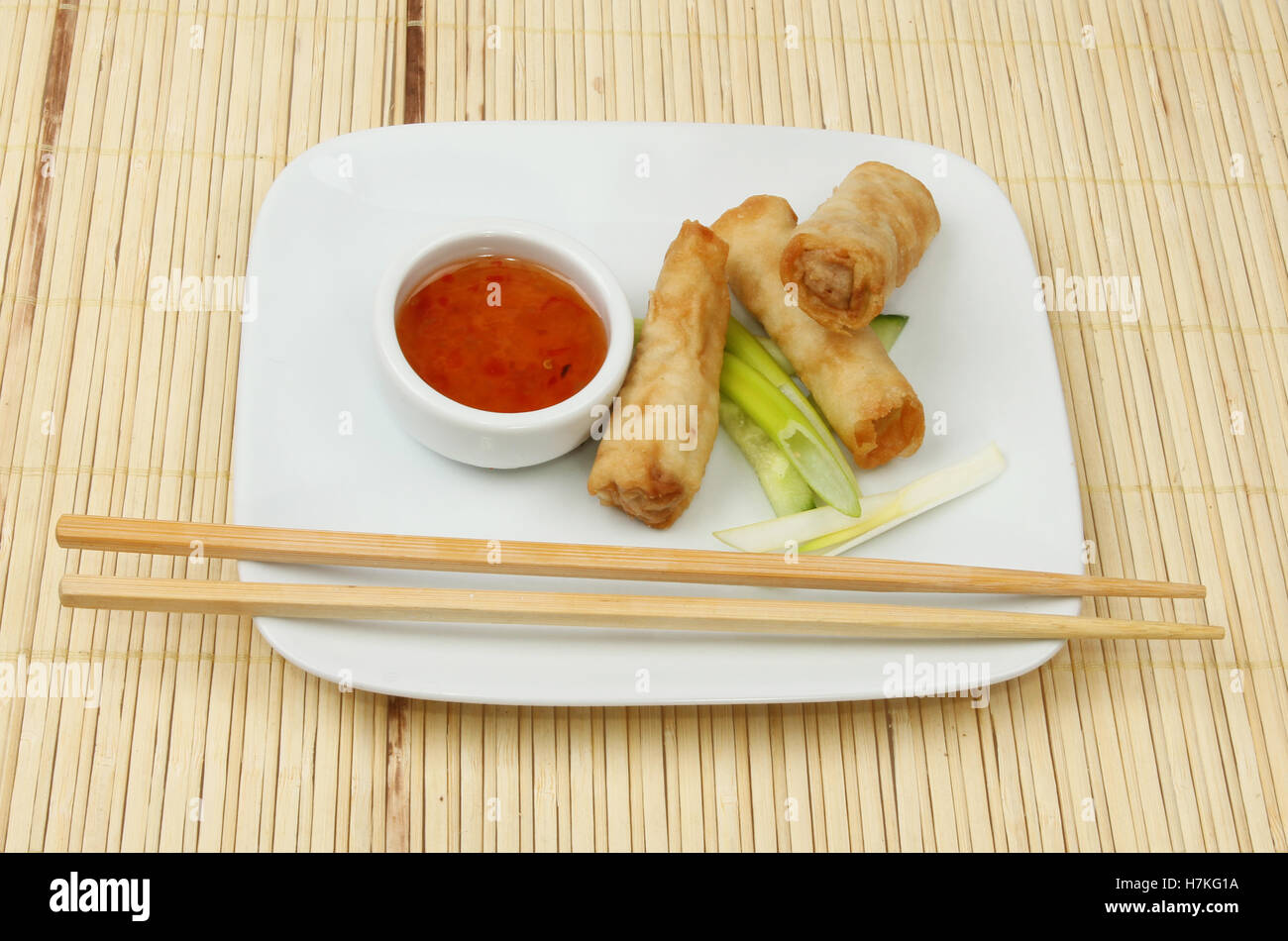 Spring rolls with spring onion, sweet chilli dipping sauce and ...