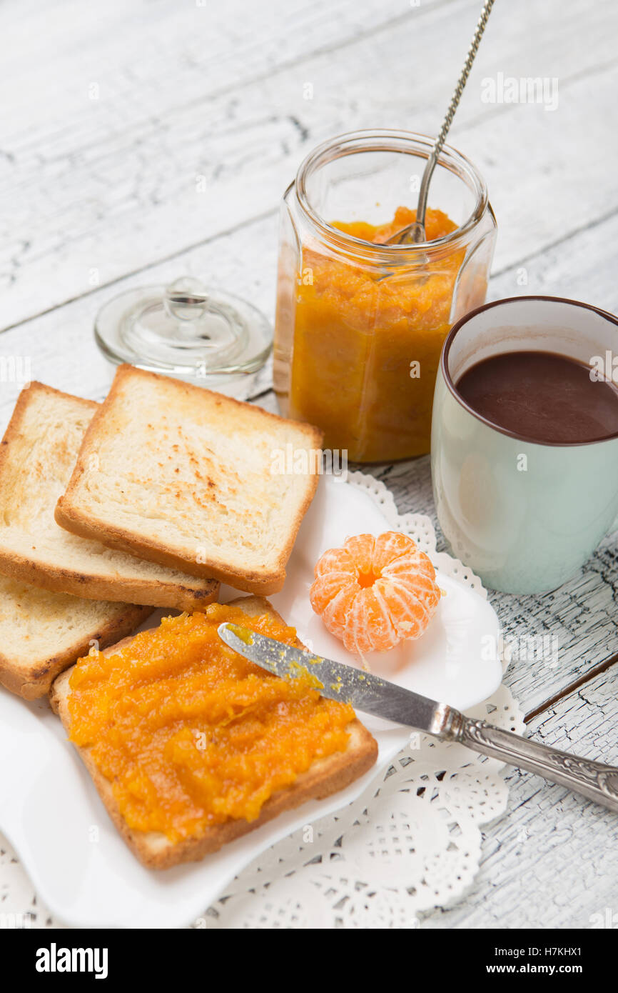 toast bread with jam on vintage wooden table Stock Photo - Alamy