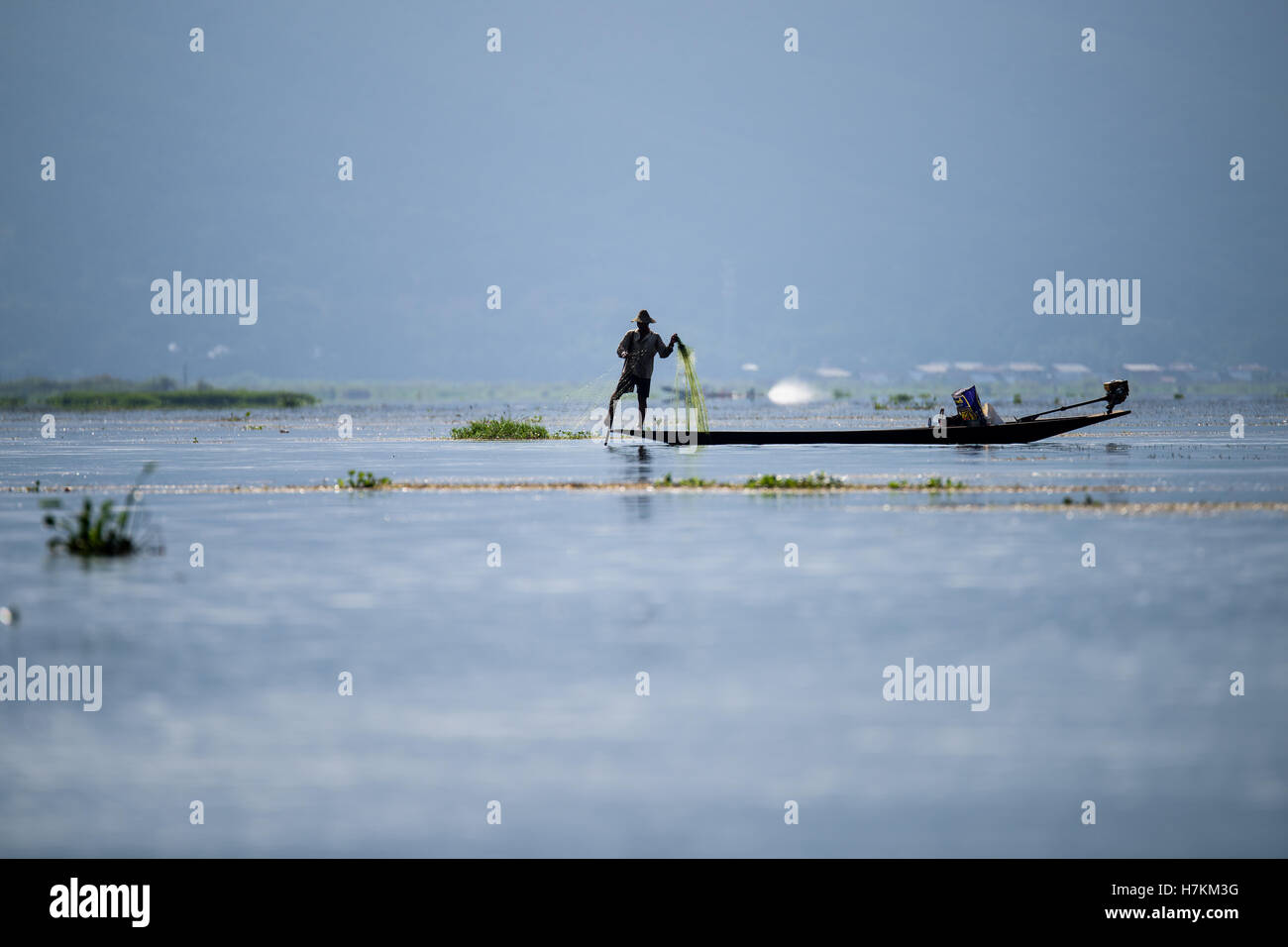Inle Lake fisherman on a boat Stock Photo - Alamy