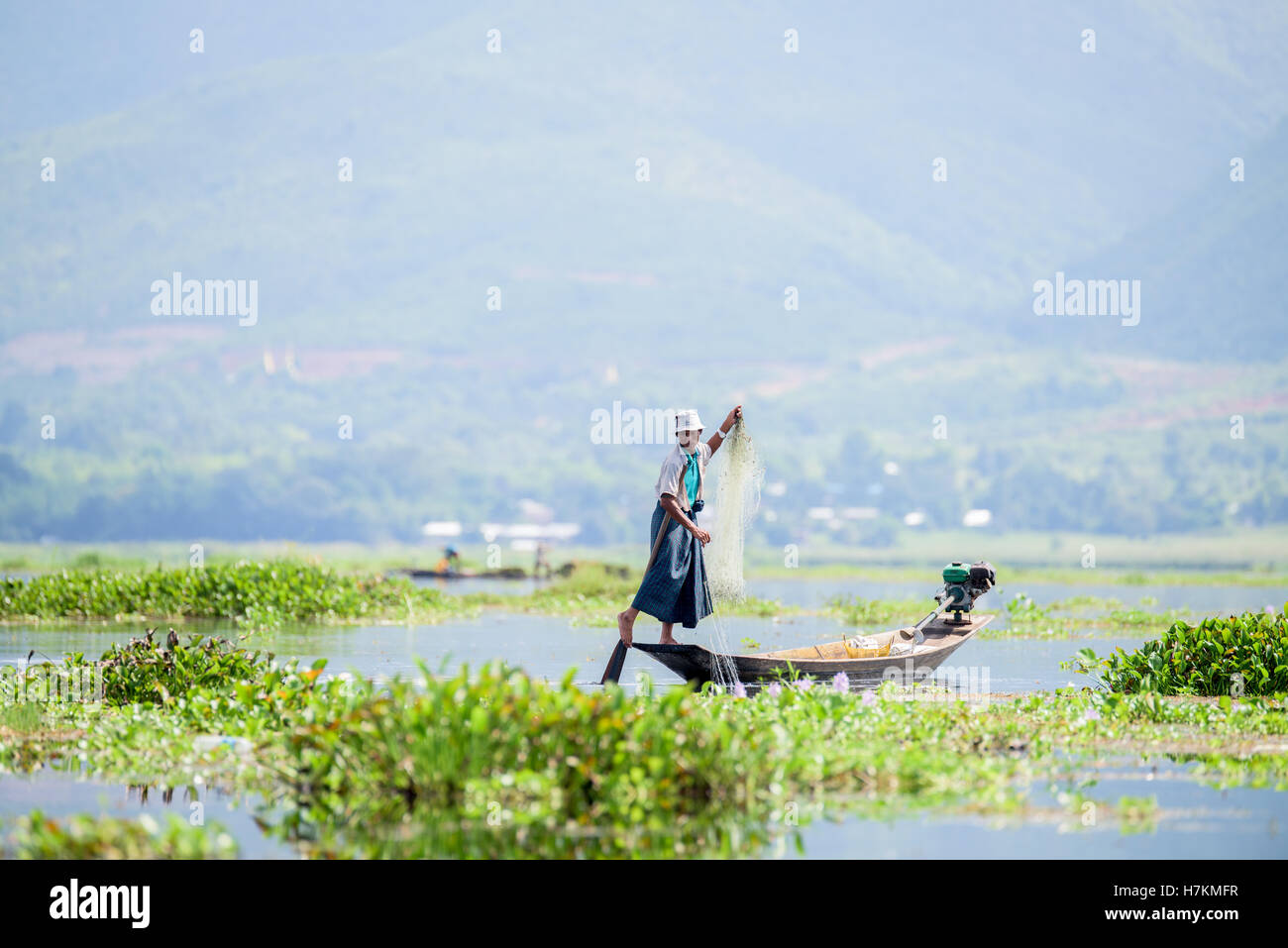 Inle Lake fisherman on a boat Stock Photo - Alamy