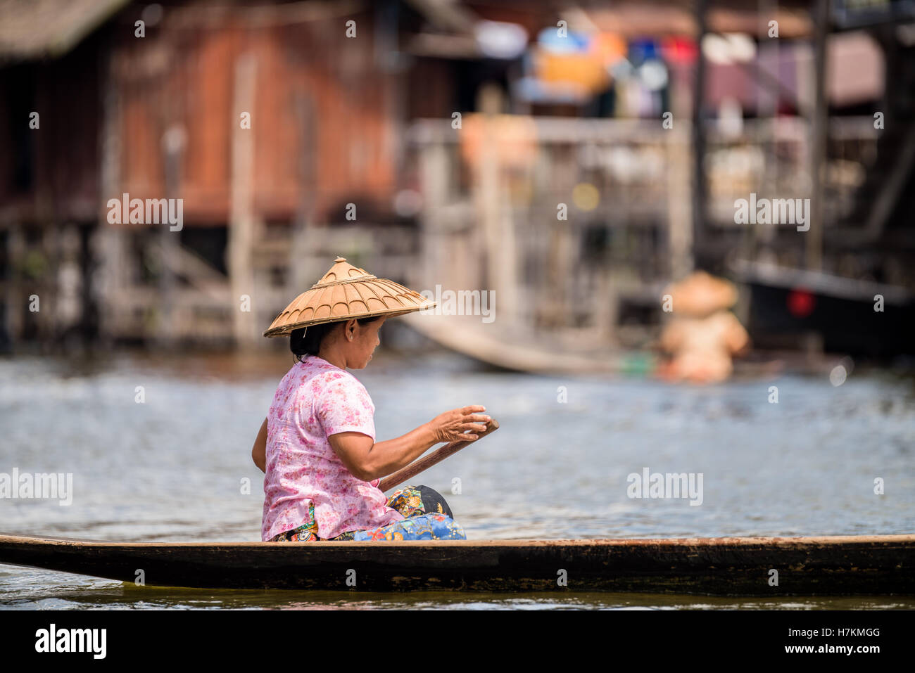 Villager on a boat on Inle lake Stock Photo - Alamy